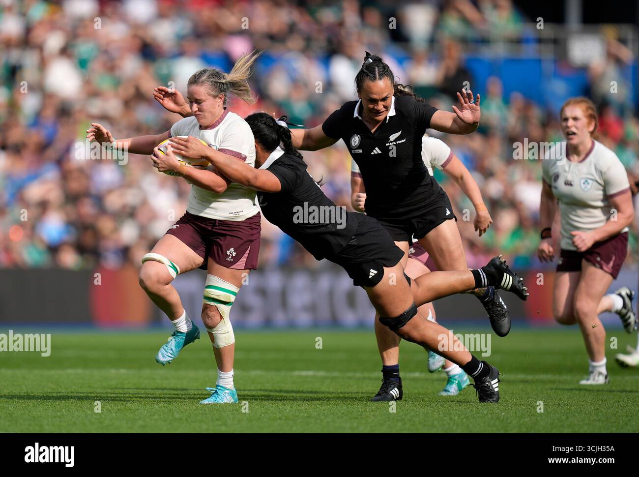 Ireland's Edel McMahon (left) is tackled by New Zealand's Liana Mikaele ...