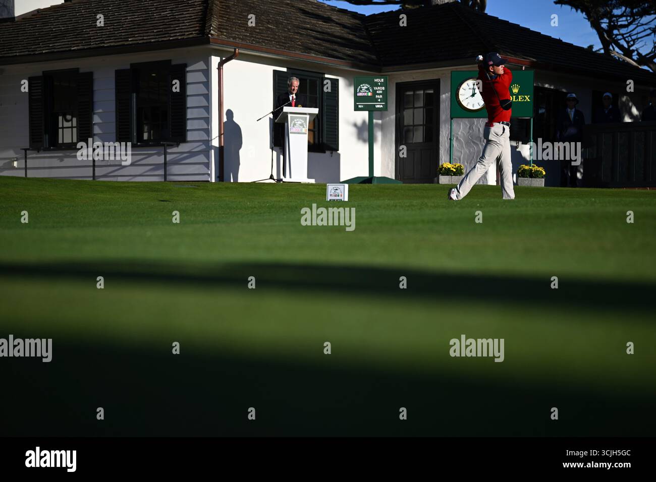 The USA team's Jackson Koivun hits from the first tee during Walker Cup ...