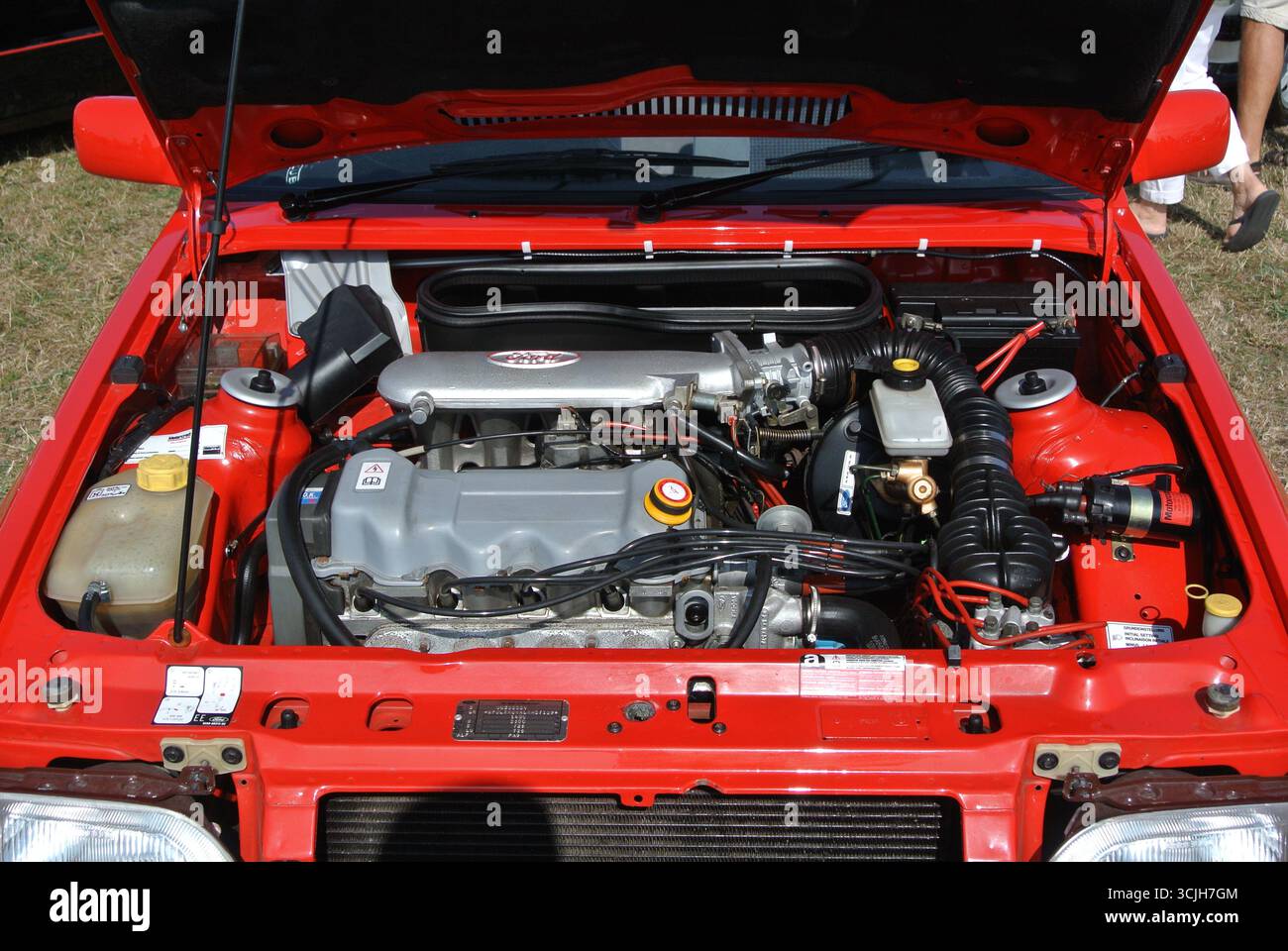 The engine of a 1989 Ford Escort XR3i parked on display at the Exmouth ...