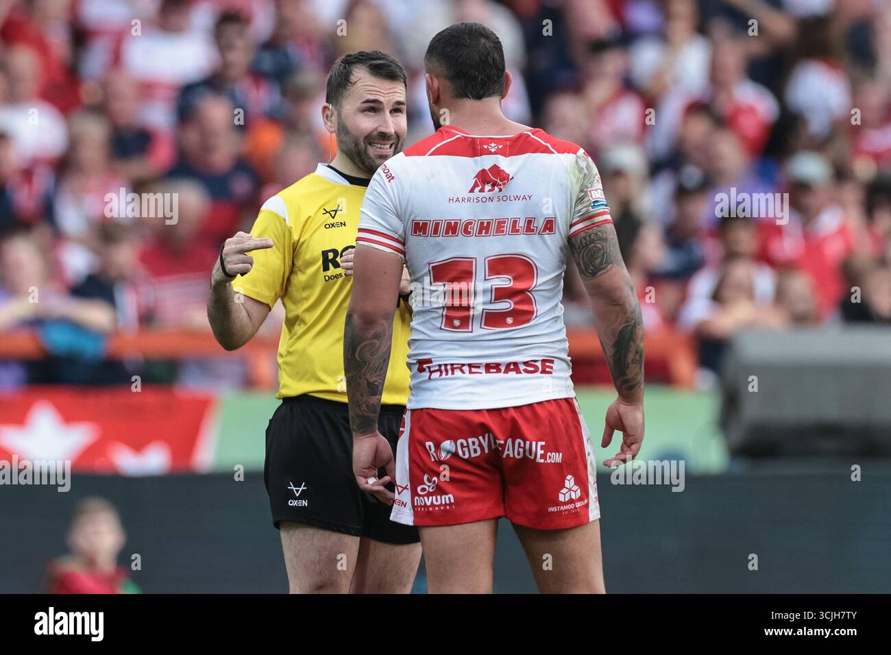 Referee Liam Moore speaks to Elliot Minchella of Hull KR before giving ...