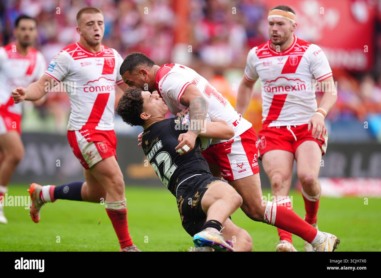 Hull KR's Elliot Minchella (right) challenges Hull FC's Lewis Martin ...