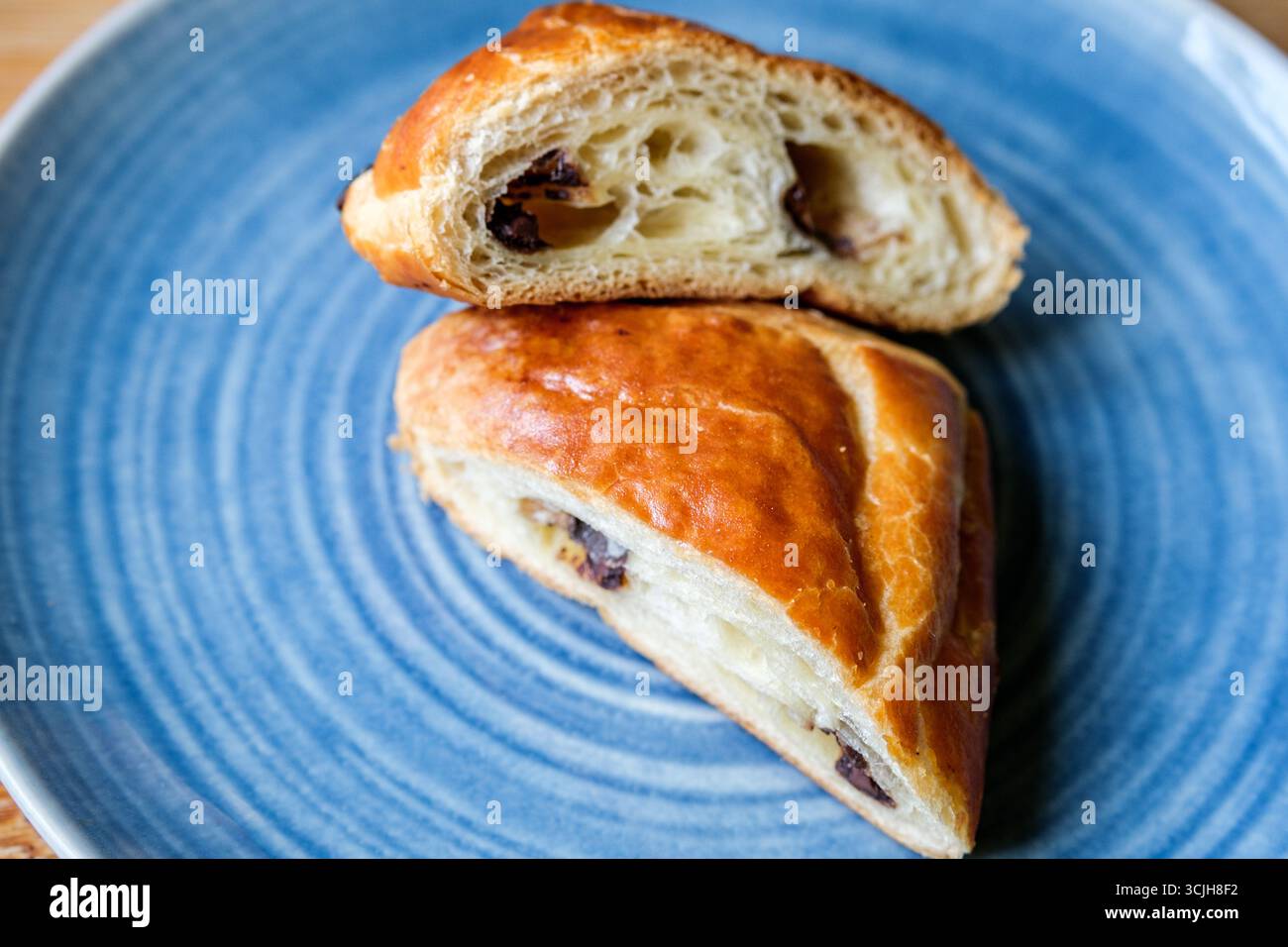 London UK, September 07 2025, Single Pain Au Chocolate Cut In Hallf on ...