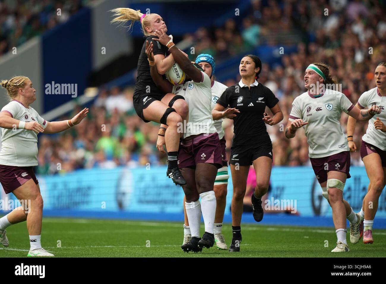 New Zealand's Jorja Miller, top, battles for the ball with Ireland's ...