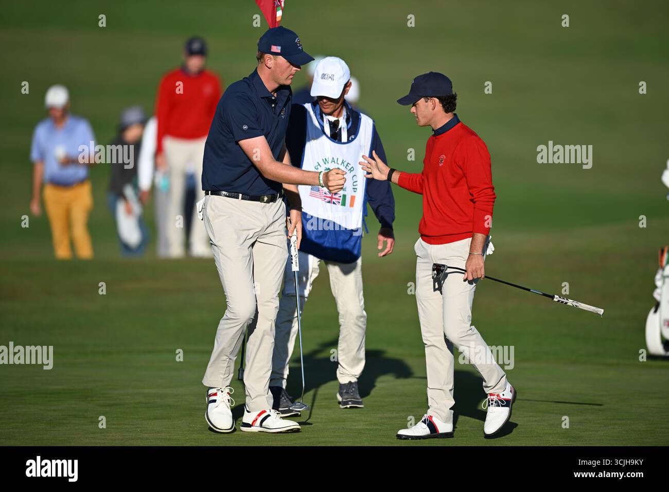 The USA team's Tommy Morrison, left, bumps fists with Jackson Koivun ...