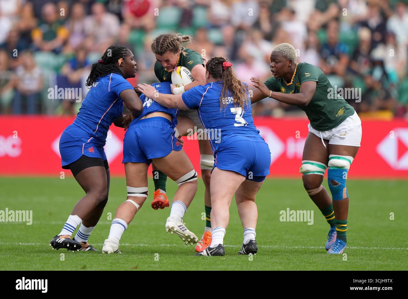 South Africa's Catha Jacobs is tackled by France's Rose Bernadou and ...