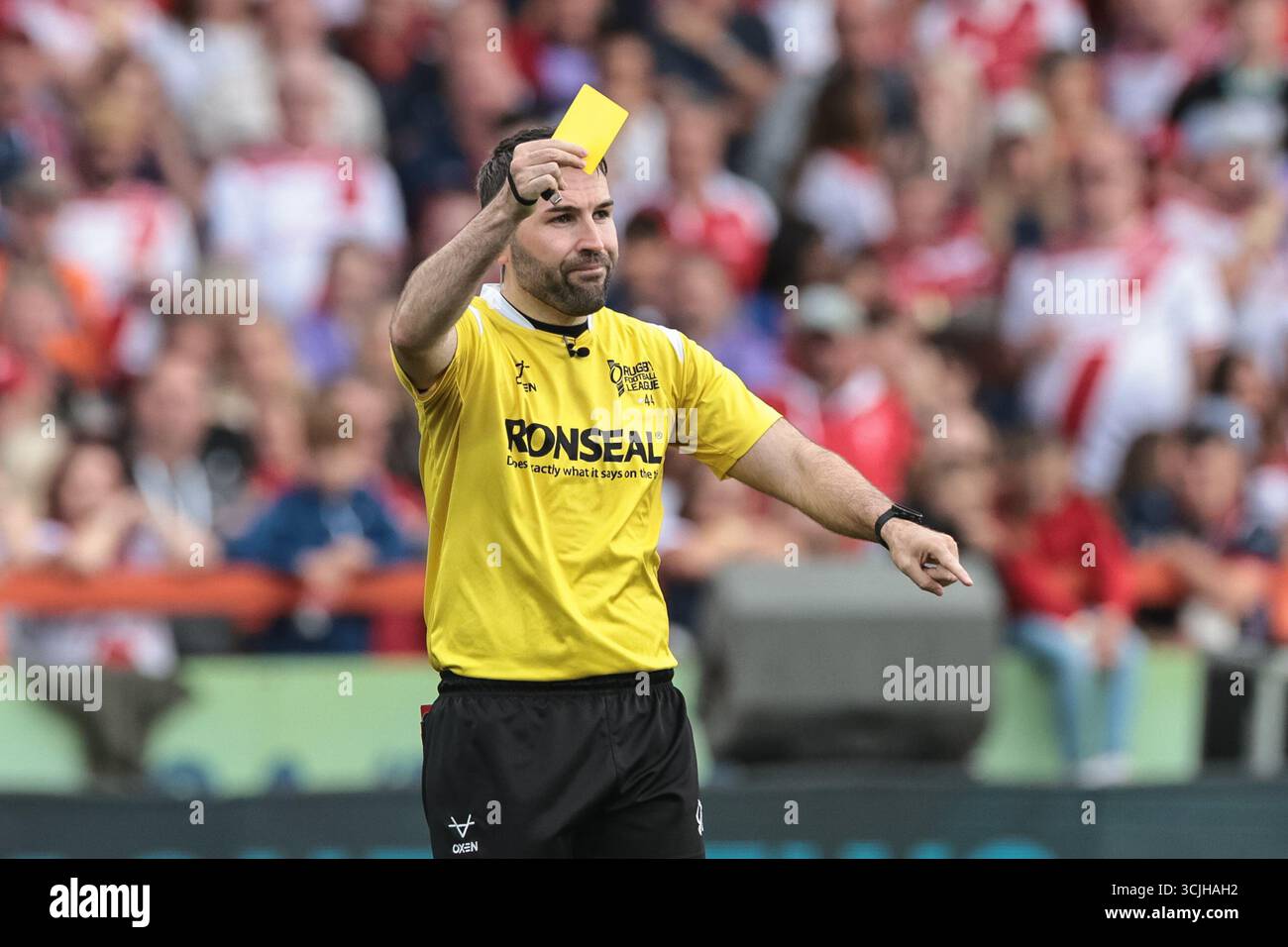 Referee Liam Moore speaks to Elliot Minchella of Hull KR before giving ...