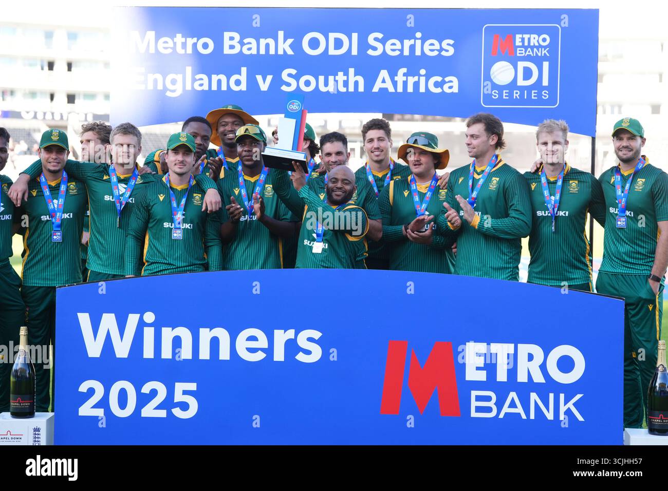 South Africa's Temba Bavuma (centre) lifts the trophy with his team ...