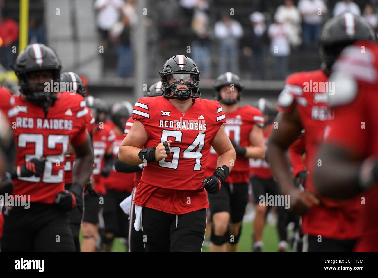 Texas Tech Texas Tech offensive lineman Jurrien Loftin (64) runs out ...