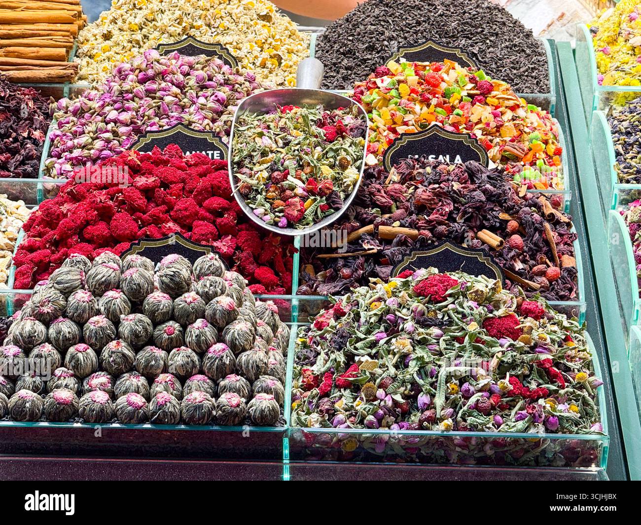 Display of teas and dried fruits in a market. Tradition, flavor, and ...