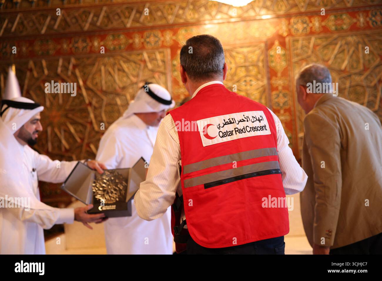 Officials from the Qatari and Syrian Red Crescents receive a Qatari ...