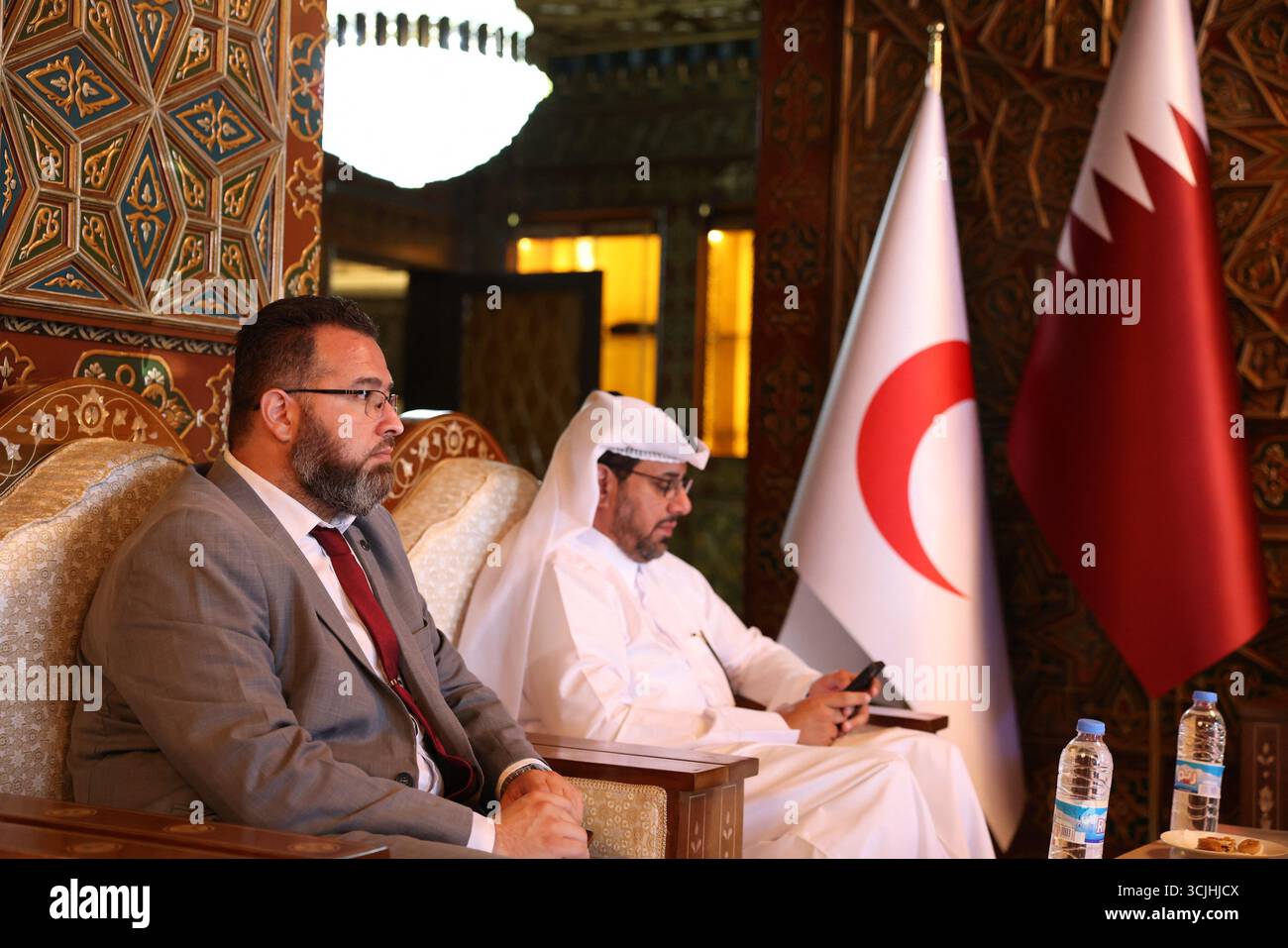 Officials from the Qatari and Syrian Red Crescents receive a Qatari ...