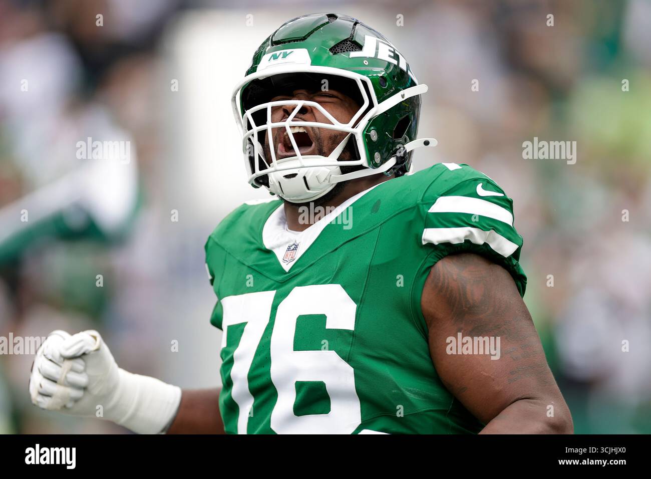 New York Jets guard John Simpson reacts while taking the field prior to ...