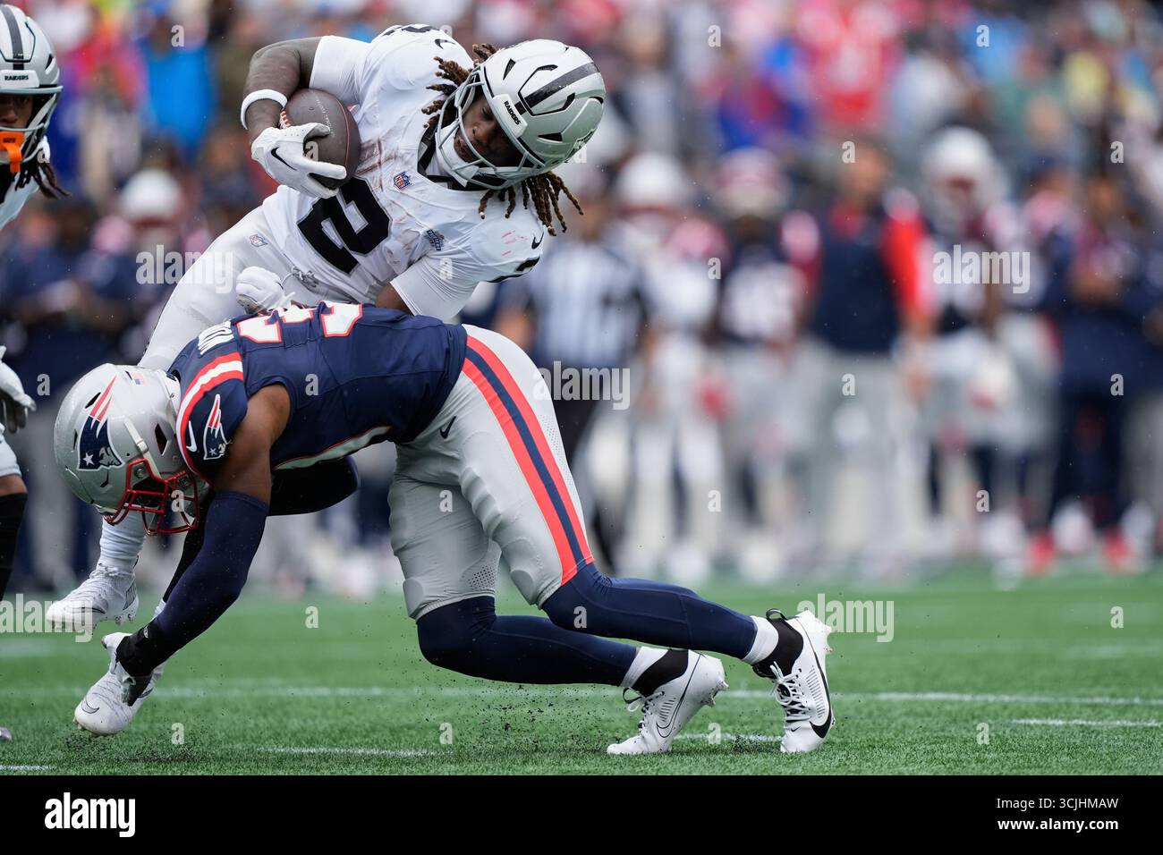 New England Patriots safety Craig Woodson (31) tackles Las Vegas ...