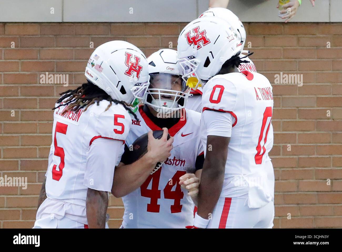 Houston running back Dean Connors (44) celebrates his touchdown with ...