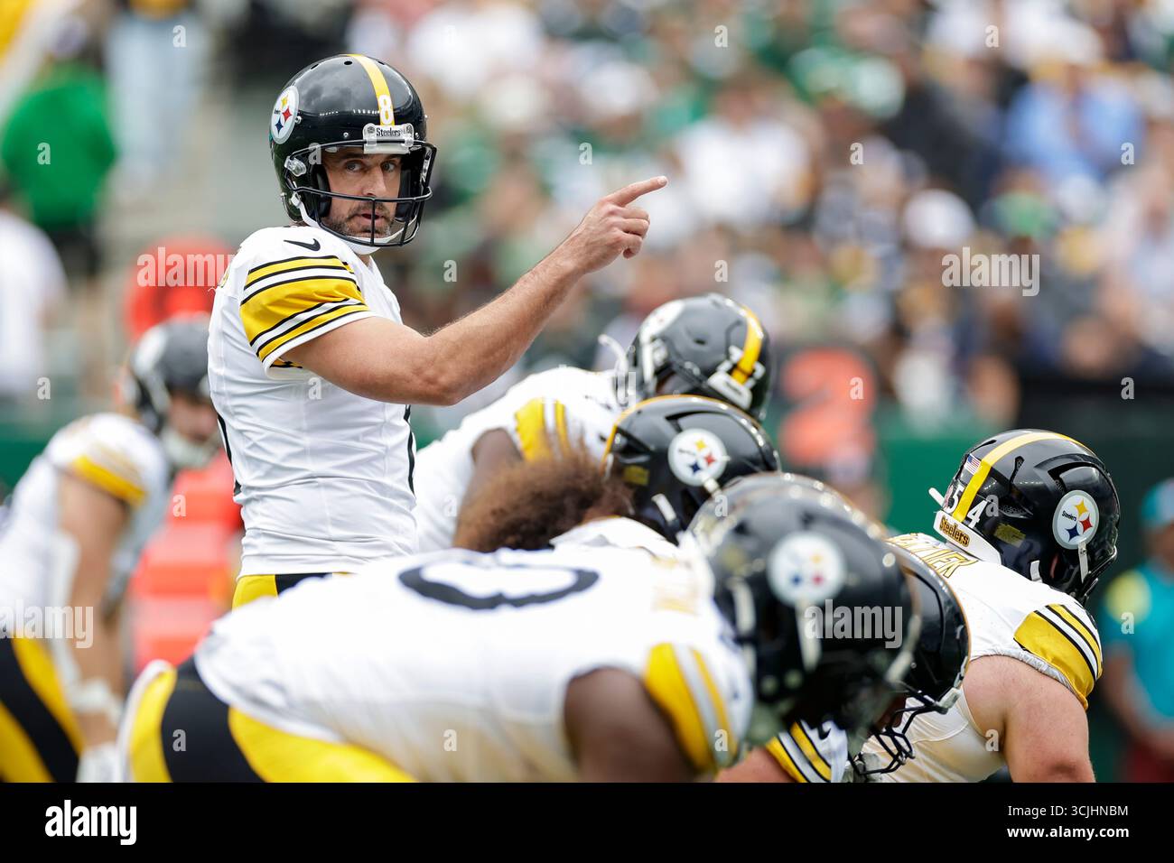 Pittsburgh Steelers quarterback Aaron Rodgers gestures before taking ...