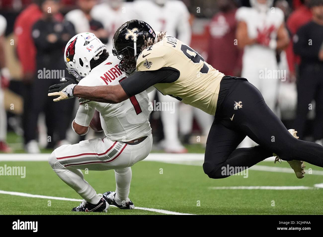 New Orleans Saints defensive end Cameron Jordan, right, sacks Arizona ...