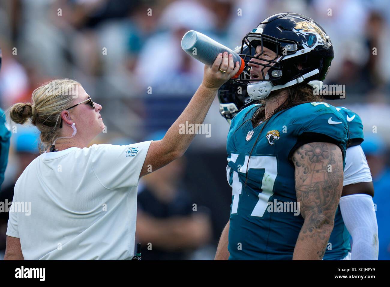 Jacksonville Jaguars tight end Patrick Herbert (47) hydrates during a ...