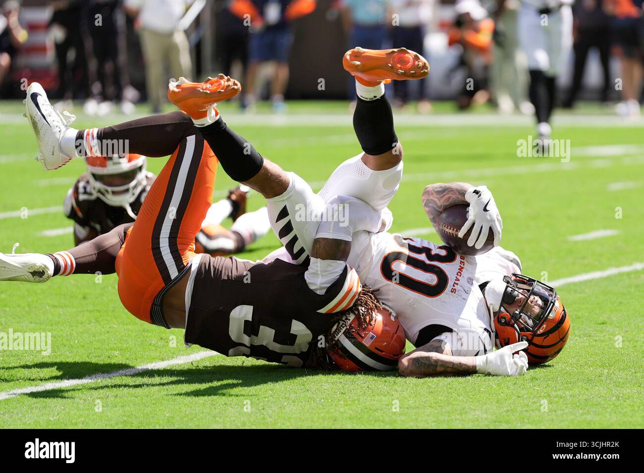 Cincinnati Bengals running back Chase Brown (30) is tackled by ...