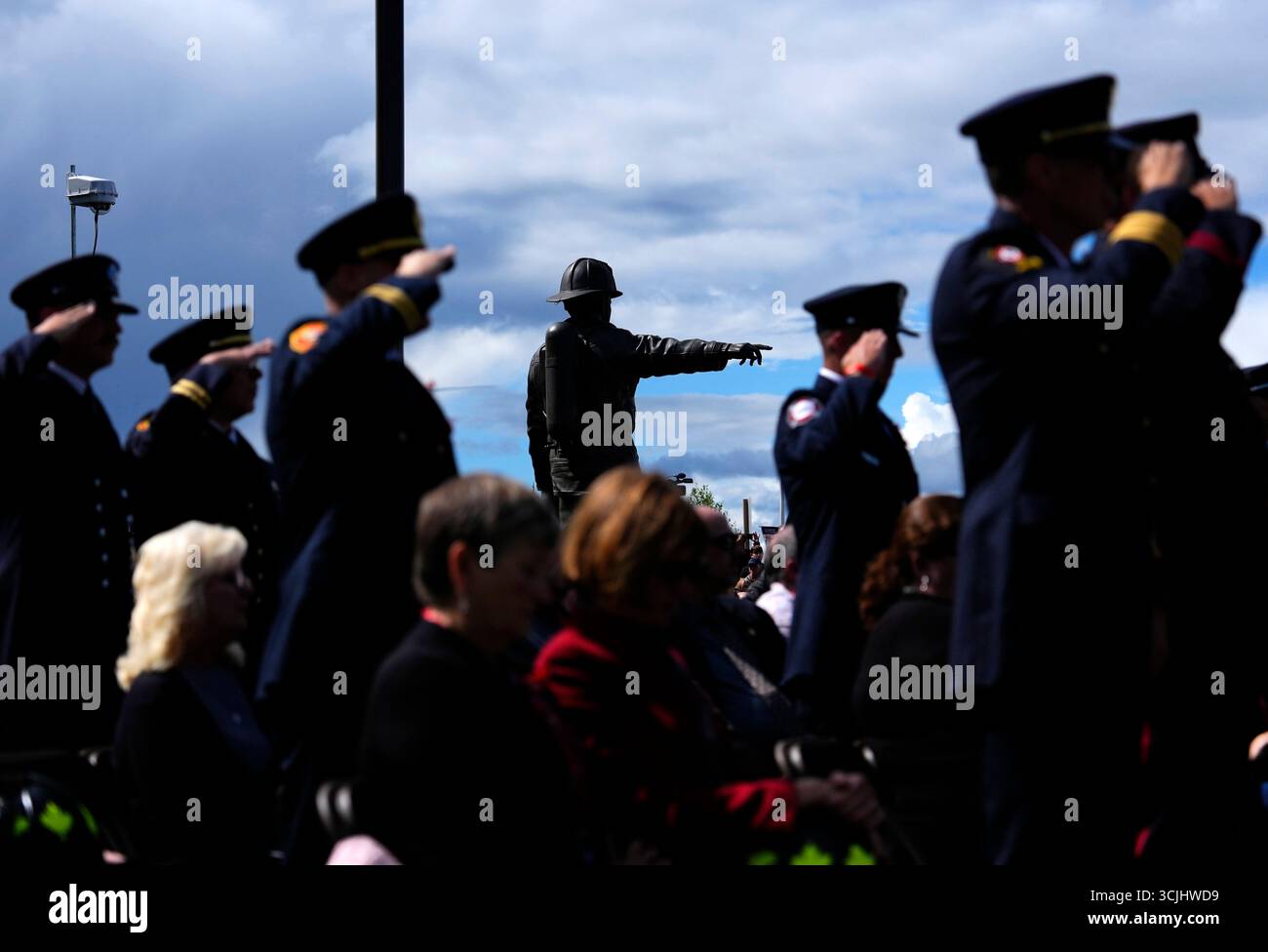 Firefighters salute during the Firefighters' National Memorial Day ...