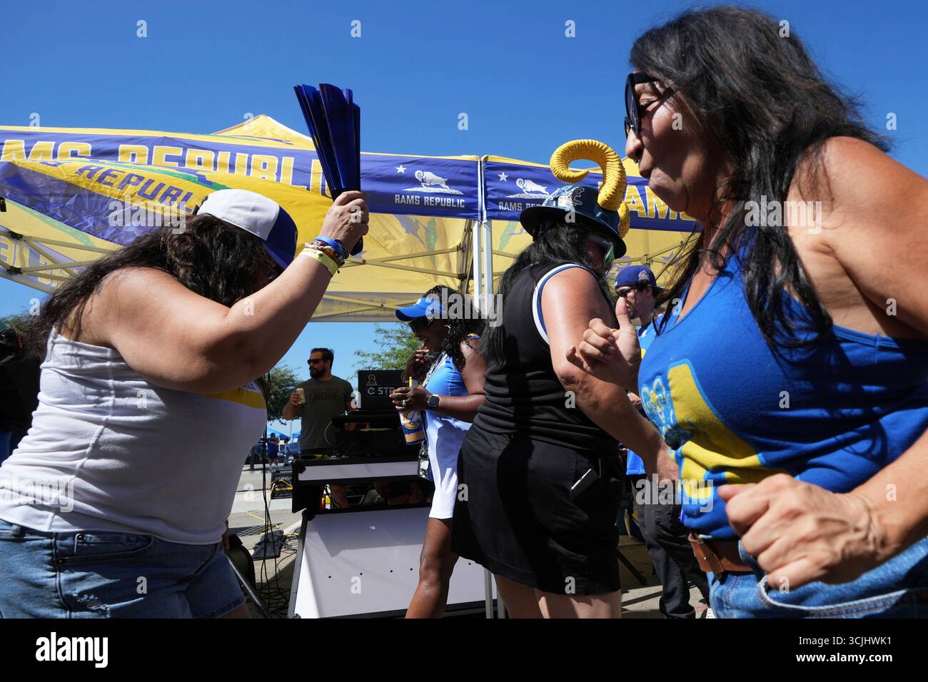 Fans tailgate before an NFL football game between the Los Angeles Rams ...
