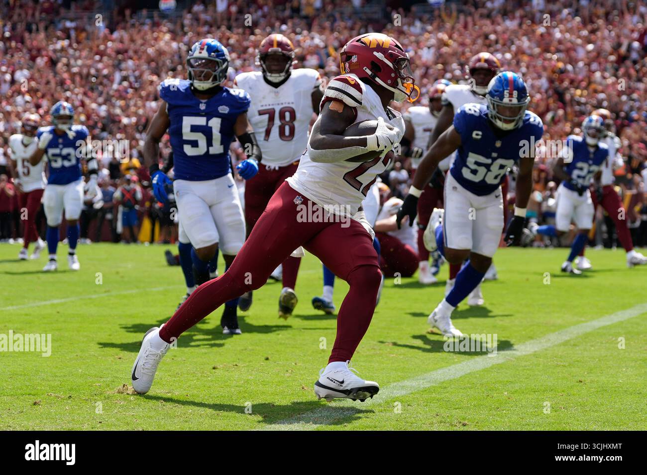 Washington Commanders cornerback Car'lin Vigers (22) scores a touchdown ...