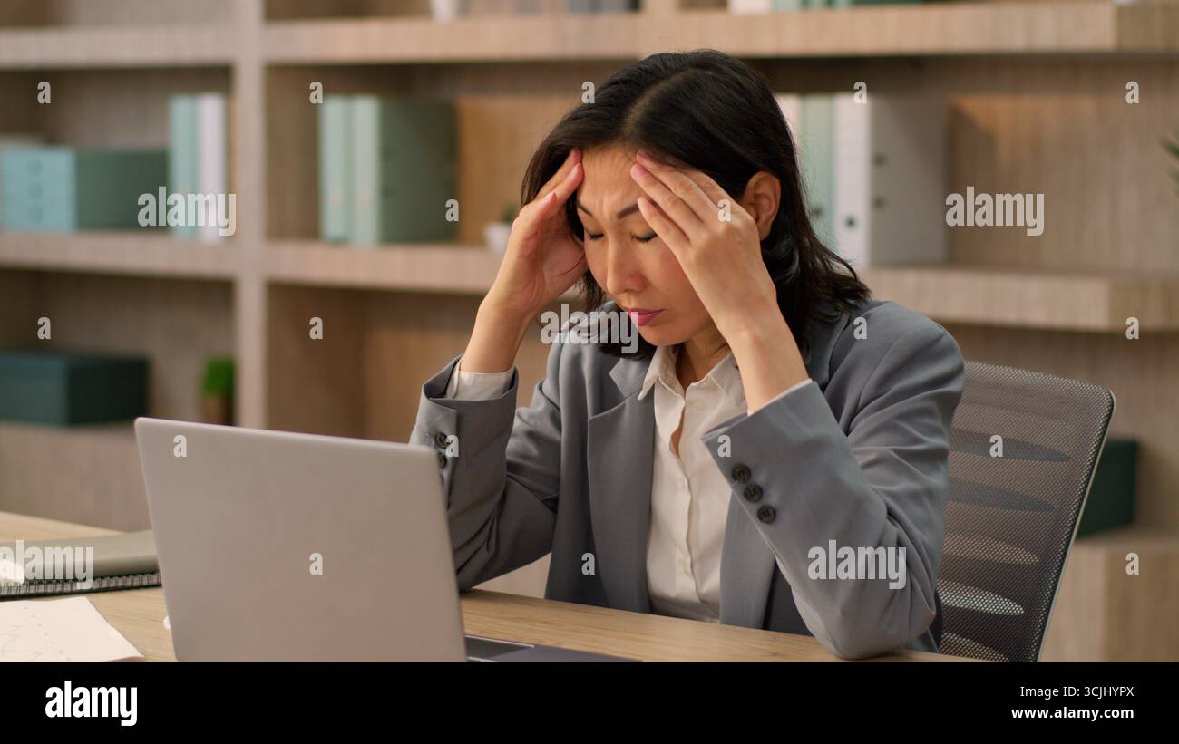 Stressed tired businesswoman frustrated Asian chinese japanese korean ...