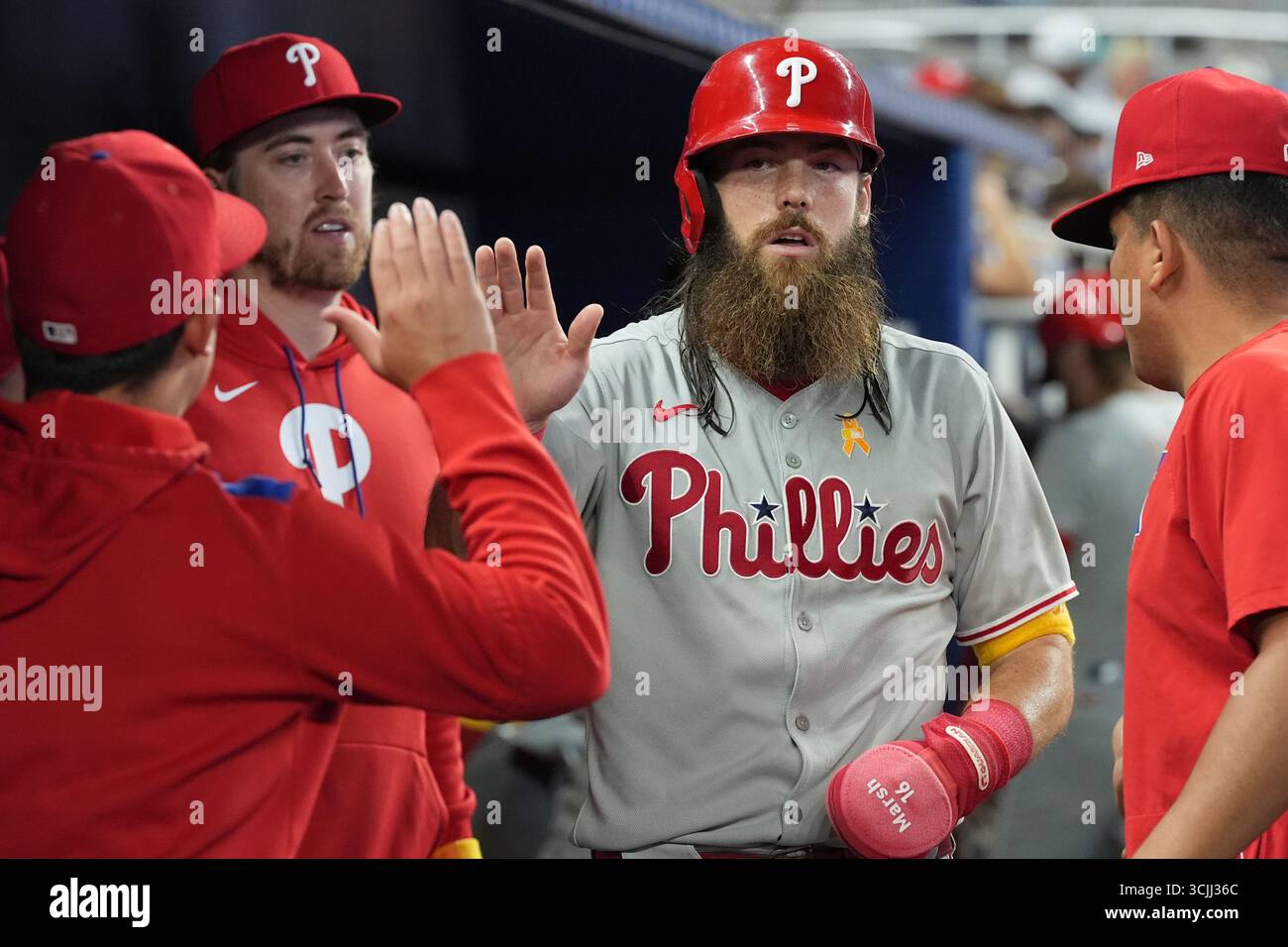 Philadelphia Phillies' Brandon Marsh celebrates after scoring on a ...
