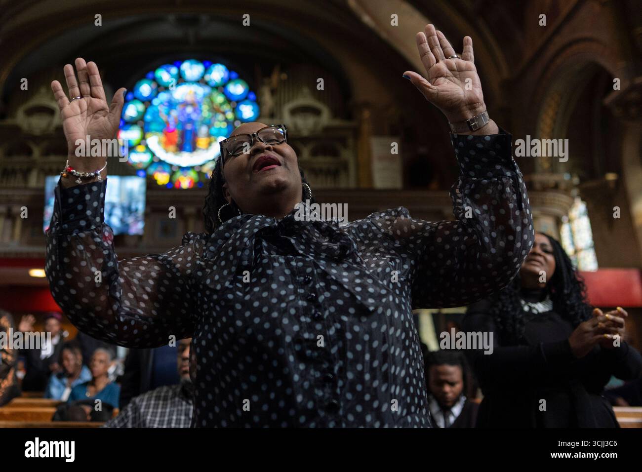 Evette Ervin worships during a service at New Mount Pilgrim Missionary ...