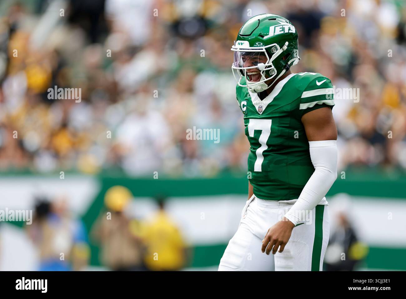 New York Jets quarterback Justin Fields reacts after taking a hit from ...