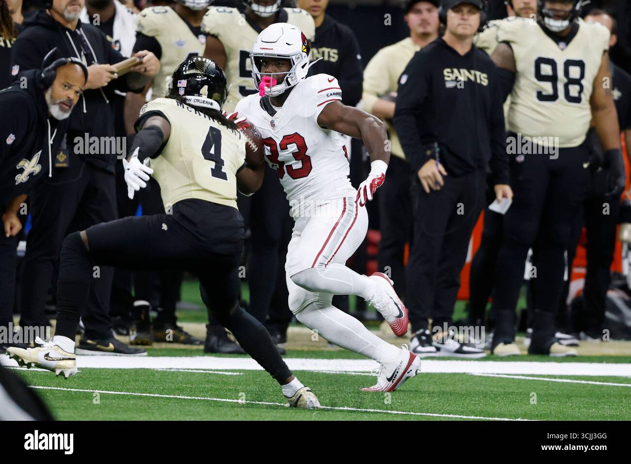 Arizona Cardinals running back Trey Benson (33) runs with the ball ...