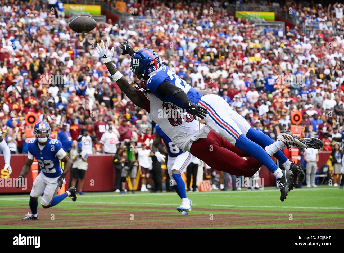 New York Giants cornerback Cor'Dale Flott (28) breaks up a pass ...