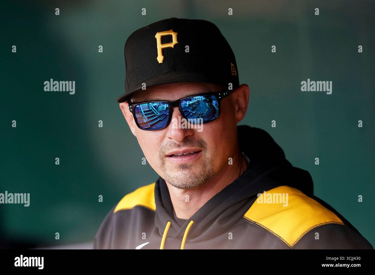 Pittsburgh Pirates manager Don Kelly sits in the dugout before a ...