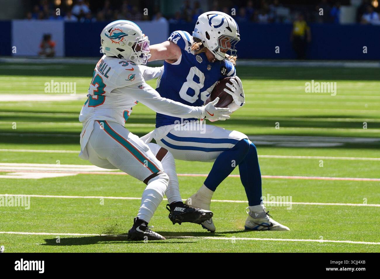 Indianapolis Colts tight end Tyler Warren (84) is tackled by Miami ...