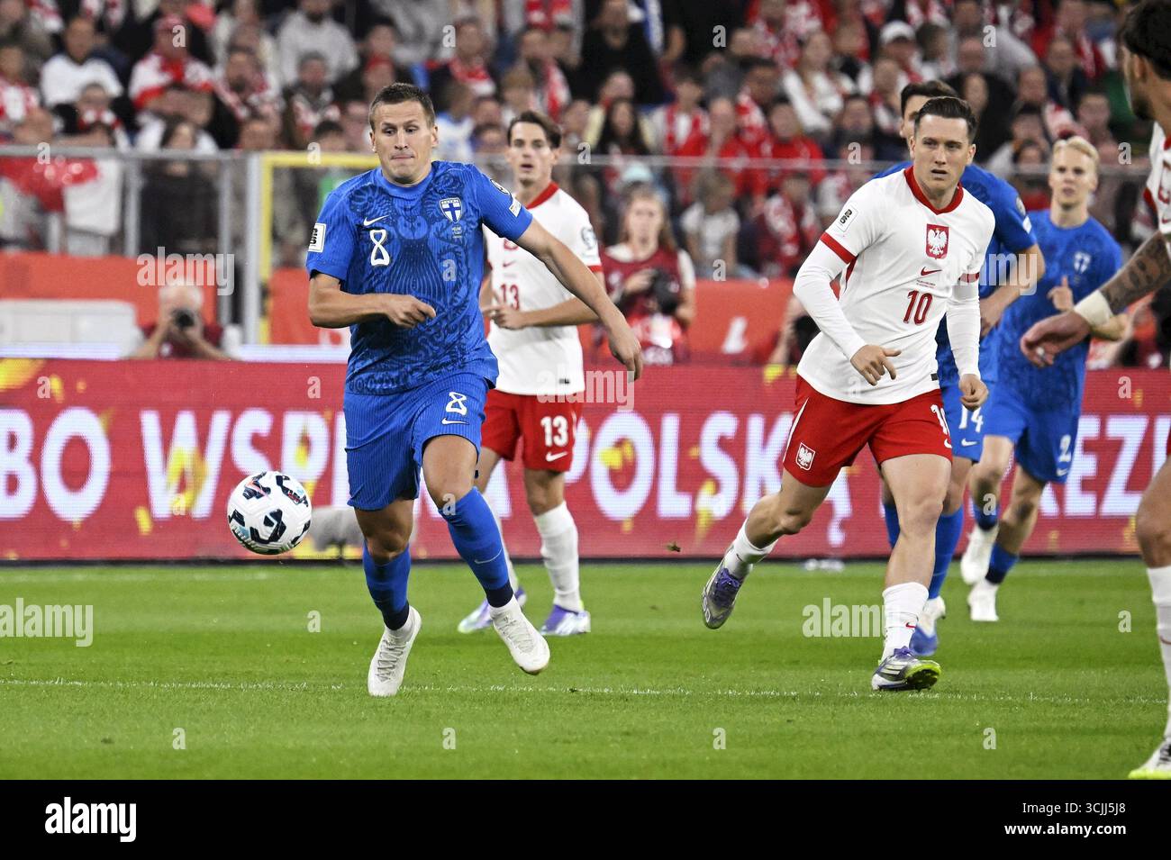 Robin Lod of Finland (left) and Piotr Zielinski of Poland in action ...