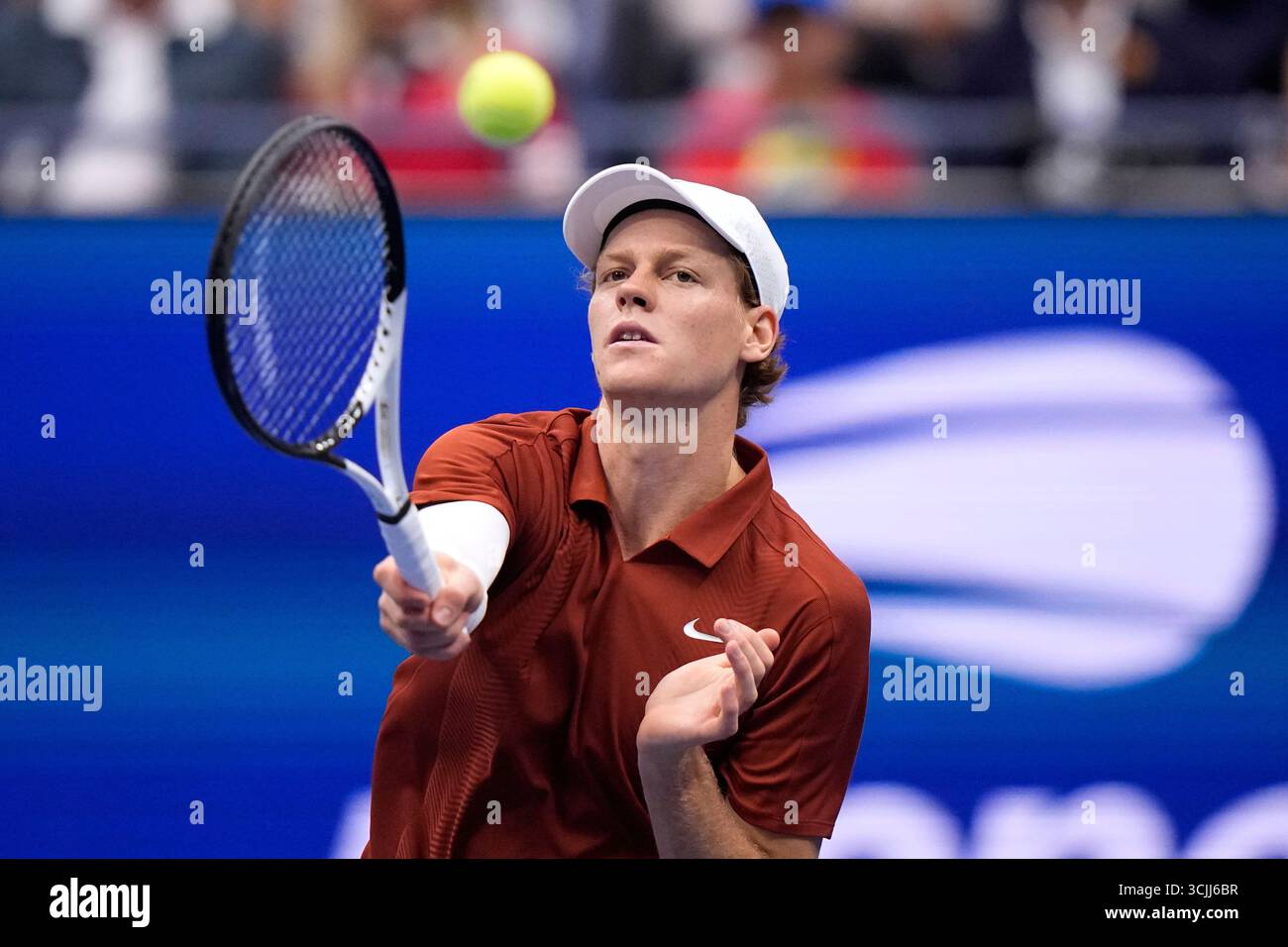Jannik Sinner, of Italy, returns a shot against Carlos Alcaraz, of ...