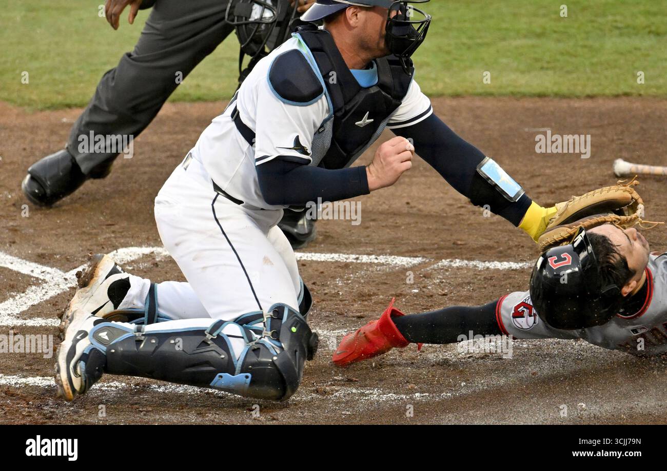 Cleveland Guardians' Steven Kwan, right, is tagged out at home by Tampa ...