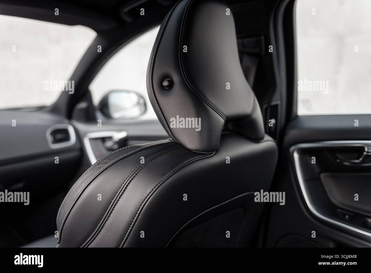 Front seat with headrest in modern car - rear three quarter view. Car ...