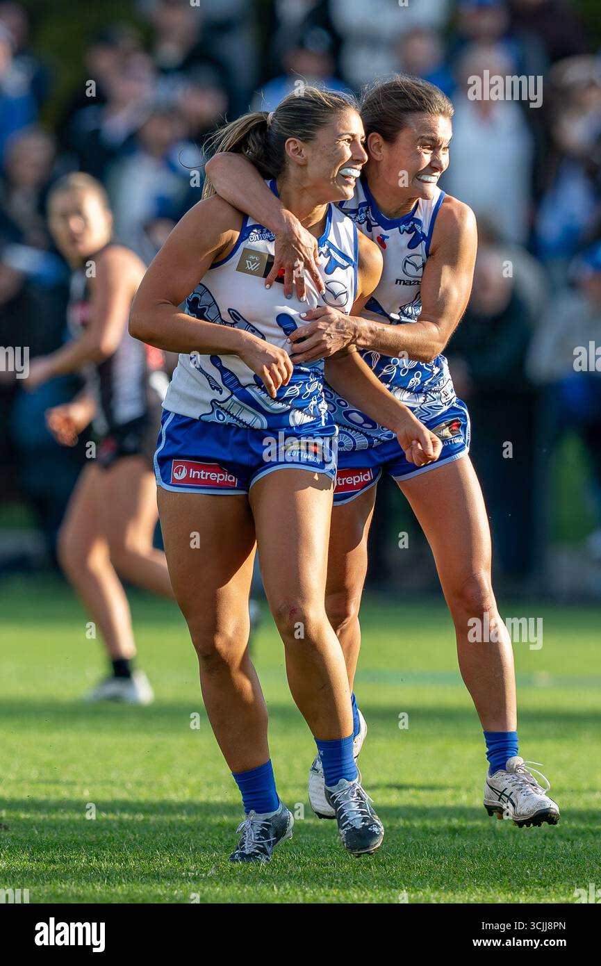 Ruby Tripodi (L) and Ash Riddell (R) of North Melbourne celebrate after ...