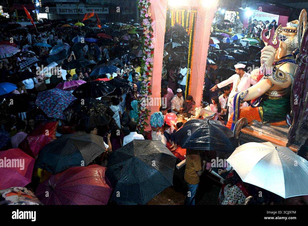 NAVI MUMBAI, INDIA - SEPTEMBER 6: Devotees immerse idols of Lord Ganesh ...