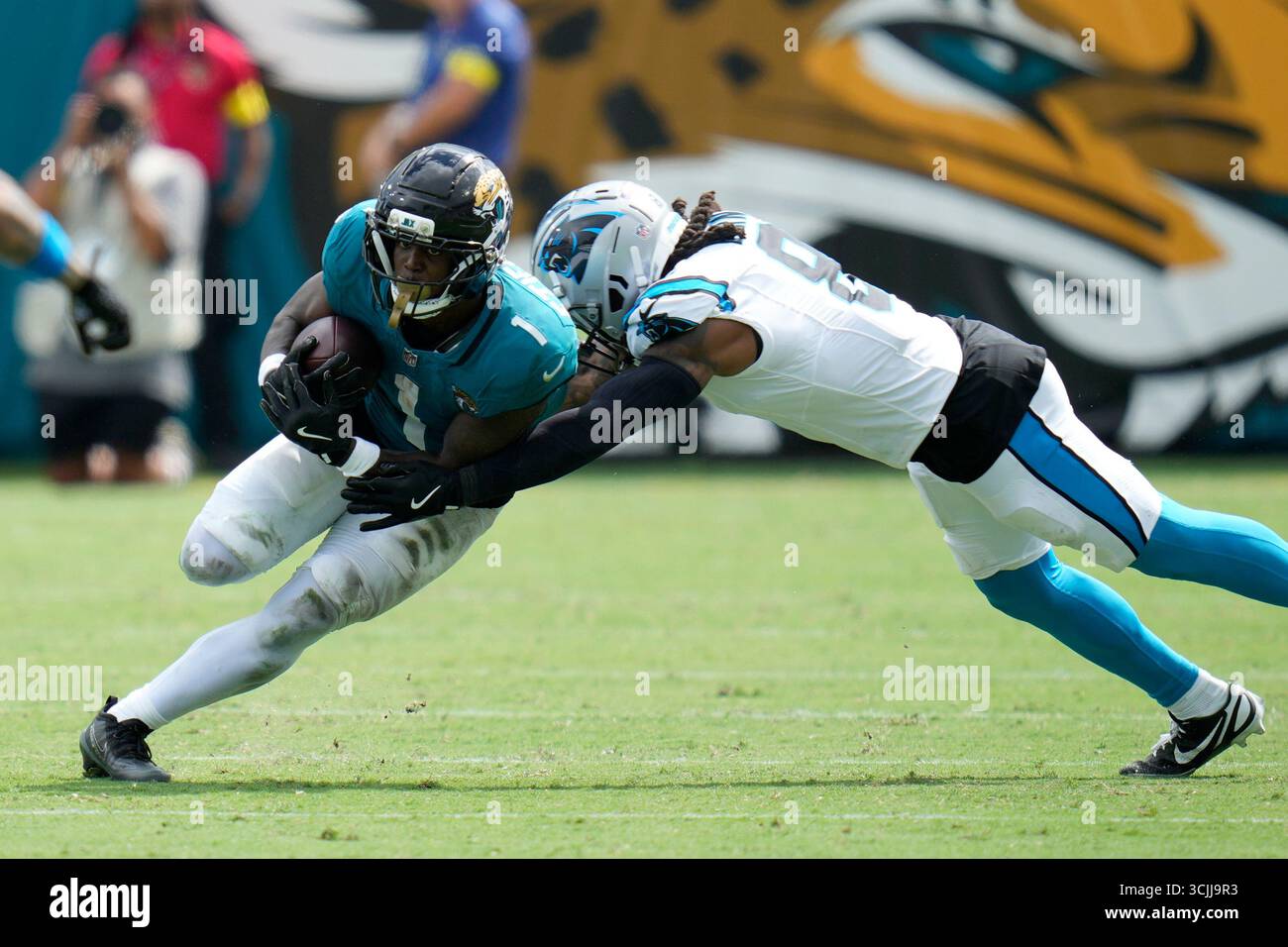 Carolina Panthers cornerback Jaycee Horn (8) tackles Jacksonville ...