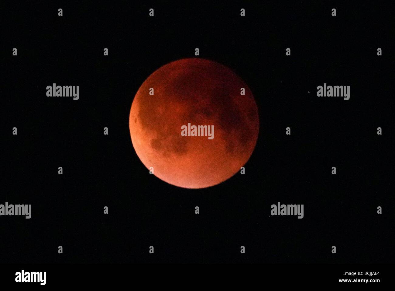 The moon appears red during a total lunar eclipse seen from Rawalpindi ...