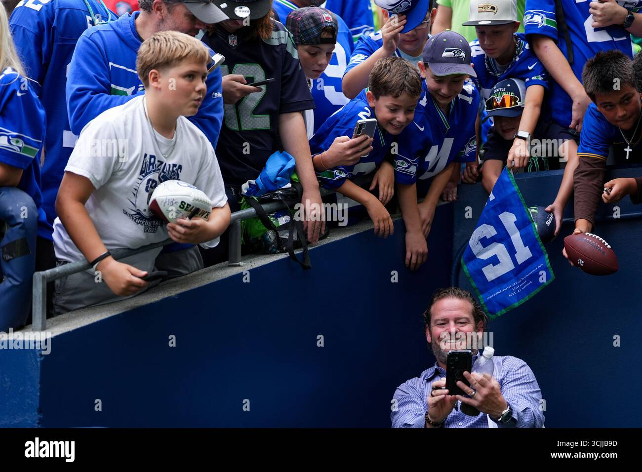 Seattle Seahawks general manager John Schneider poses for photos with ...