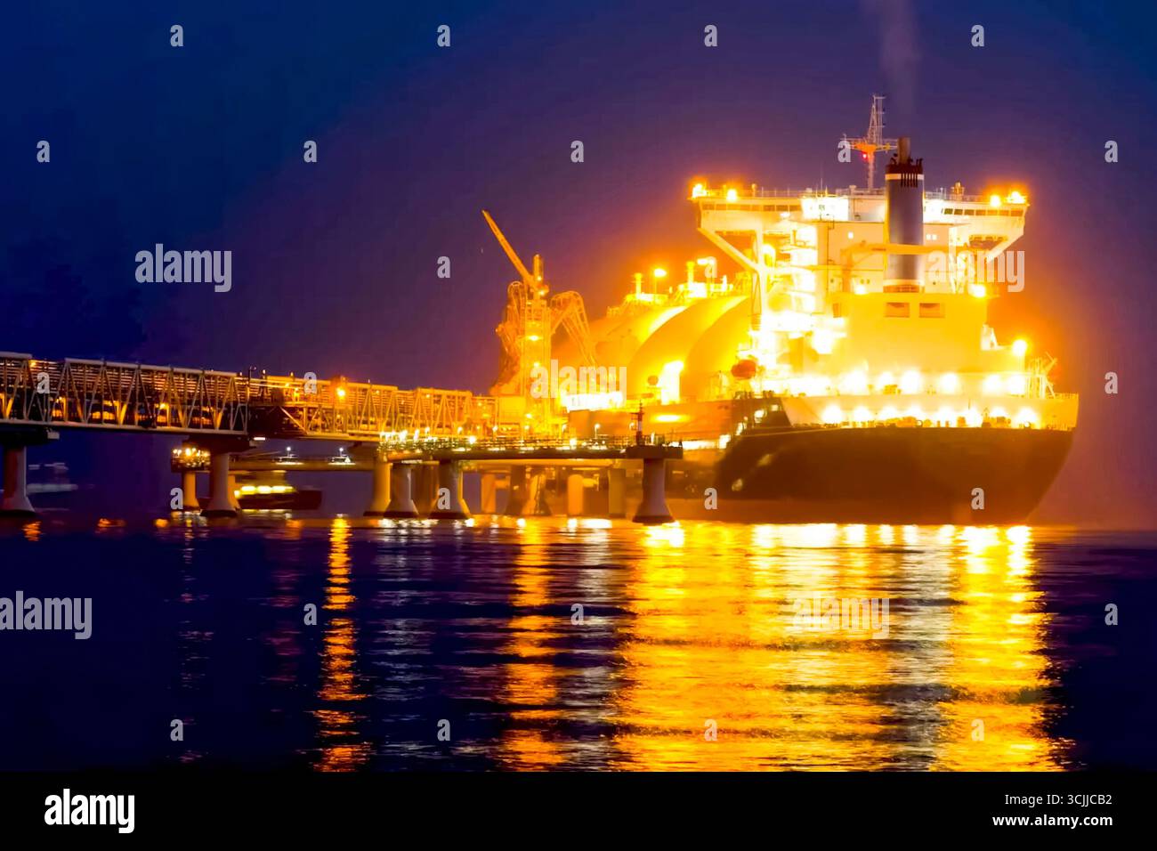 Liquefied natural gas tanker in port with fueling terminal. Night ...