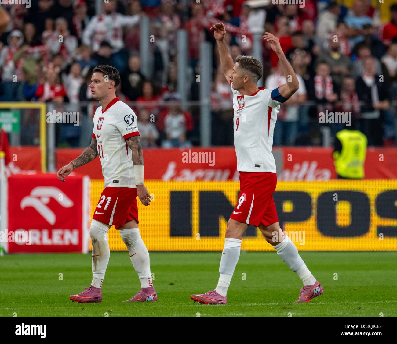 Robert Lewandowski of Poland celebrates scoring with team mates during ...