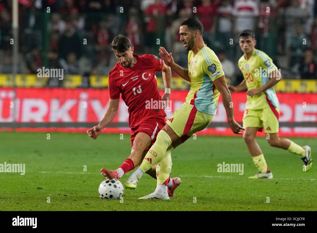 Turkey's Ismail Yuksek, left, challenges Spain's Mikel Merino during a ...