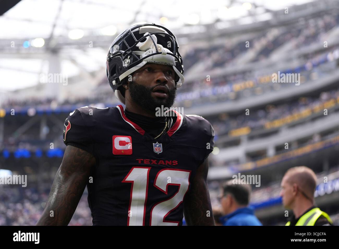 Houston Texans wide receiver Nico Collins (12) walks on the field ...