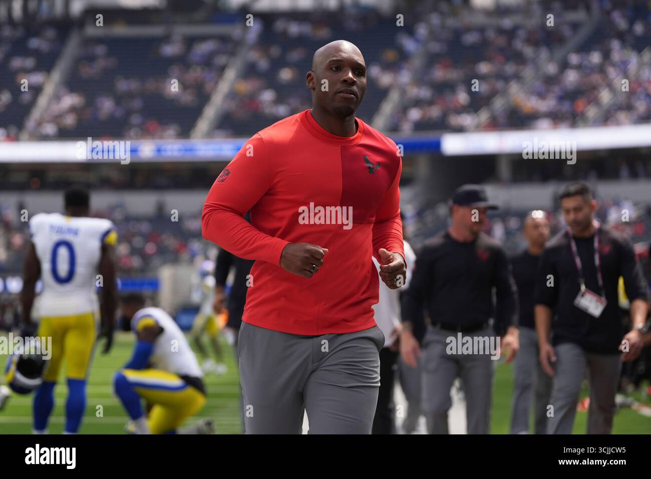 Houston Texans head coach DeMeco Ryans jogs on the field before an NFL ...