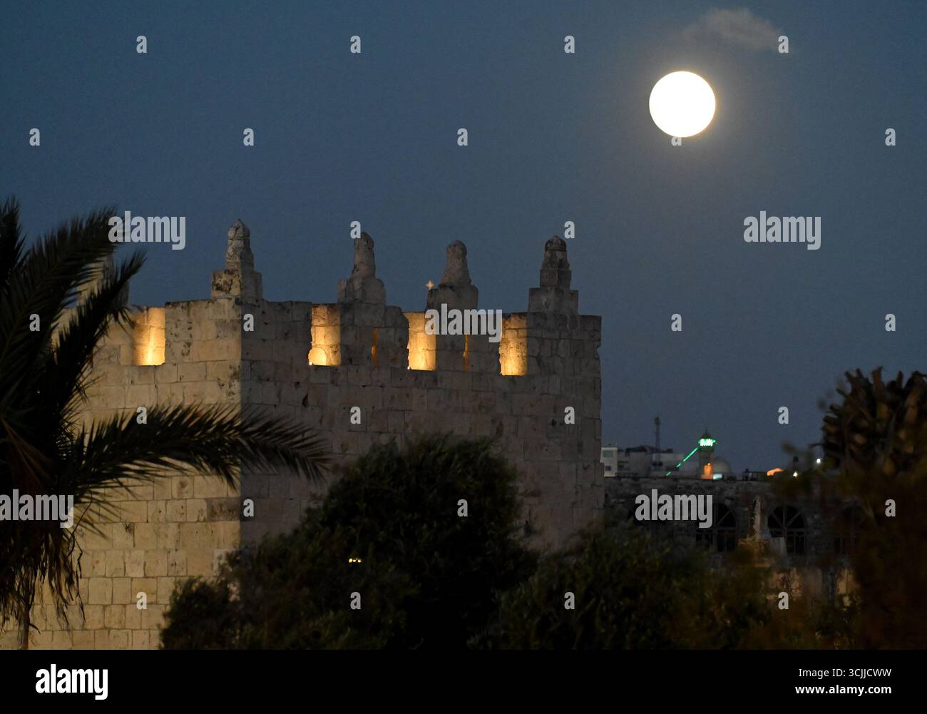 The moon is seen over the Old City of Jerusalem at the start of the ...
