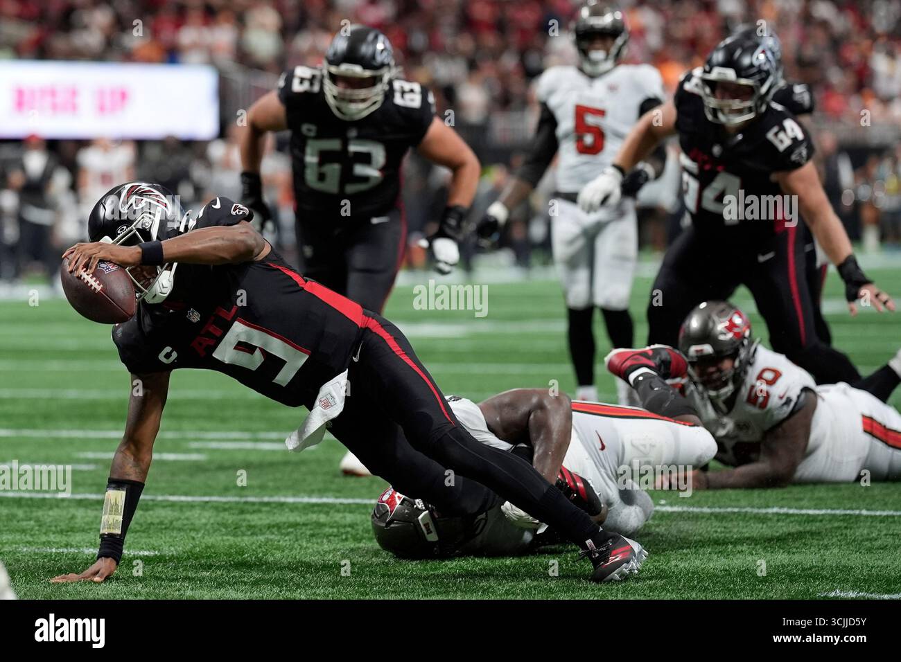 Atlanta Falcons quarterback Michael Penix Jr. (9) scores a touchdown during the second half of ...
