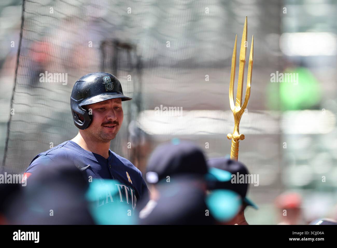 Seattle Mariners' Cal Raleigh hoists the celebratory trident after ...